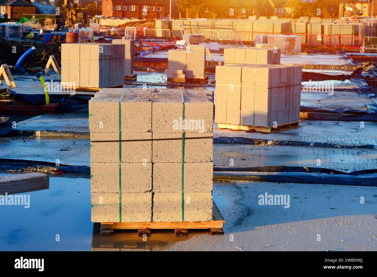 Bricks and concrete blocks delivered to construction site and placed ...