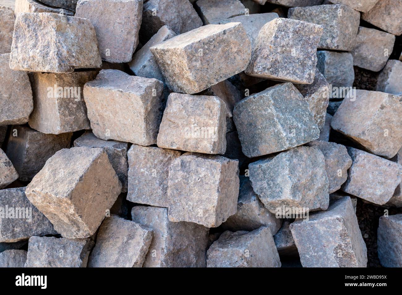 Resurfacing the road surface, manual laying of porphyry cubes on the ...