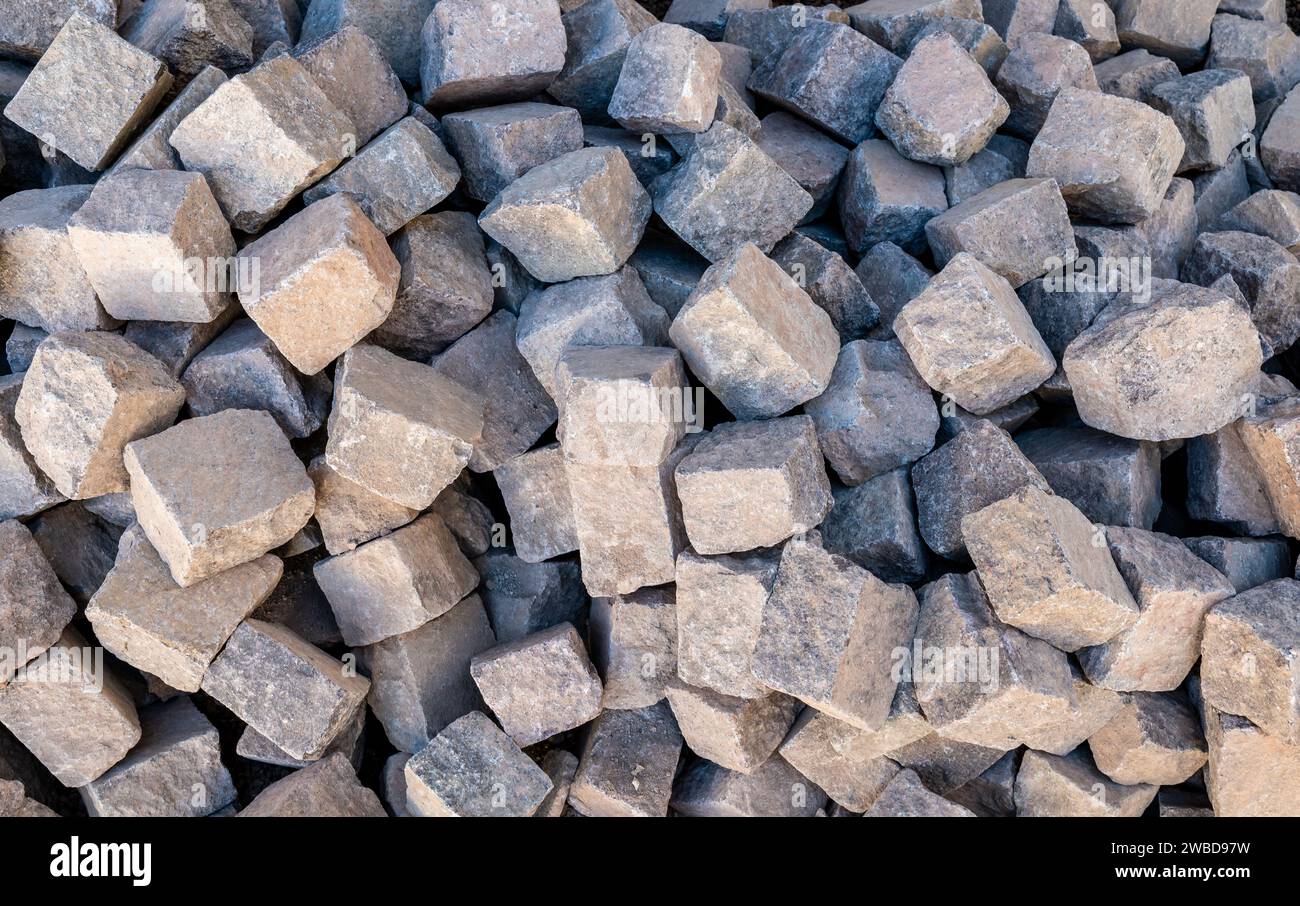 Resurfacing the road surface, manual laying of porphyry cubes on the ...