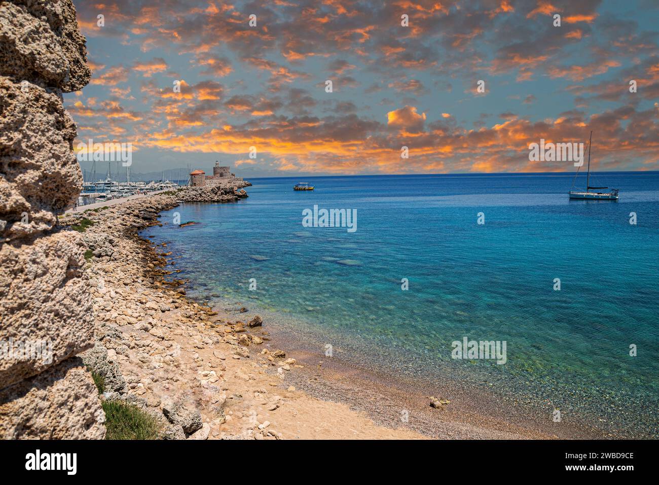 View along of Pl. Neoriou, Mandraki Marina Port, Rhodes island, Greece ...