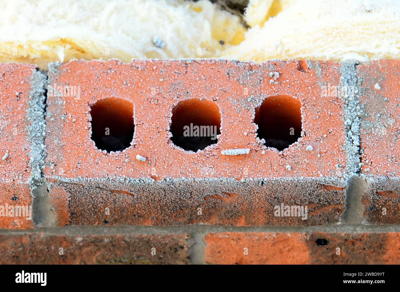 Insulating walls of new build houses by placing rock wool inside wall ...