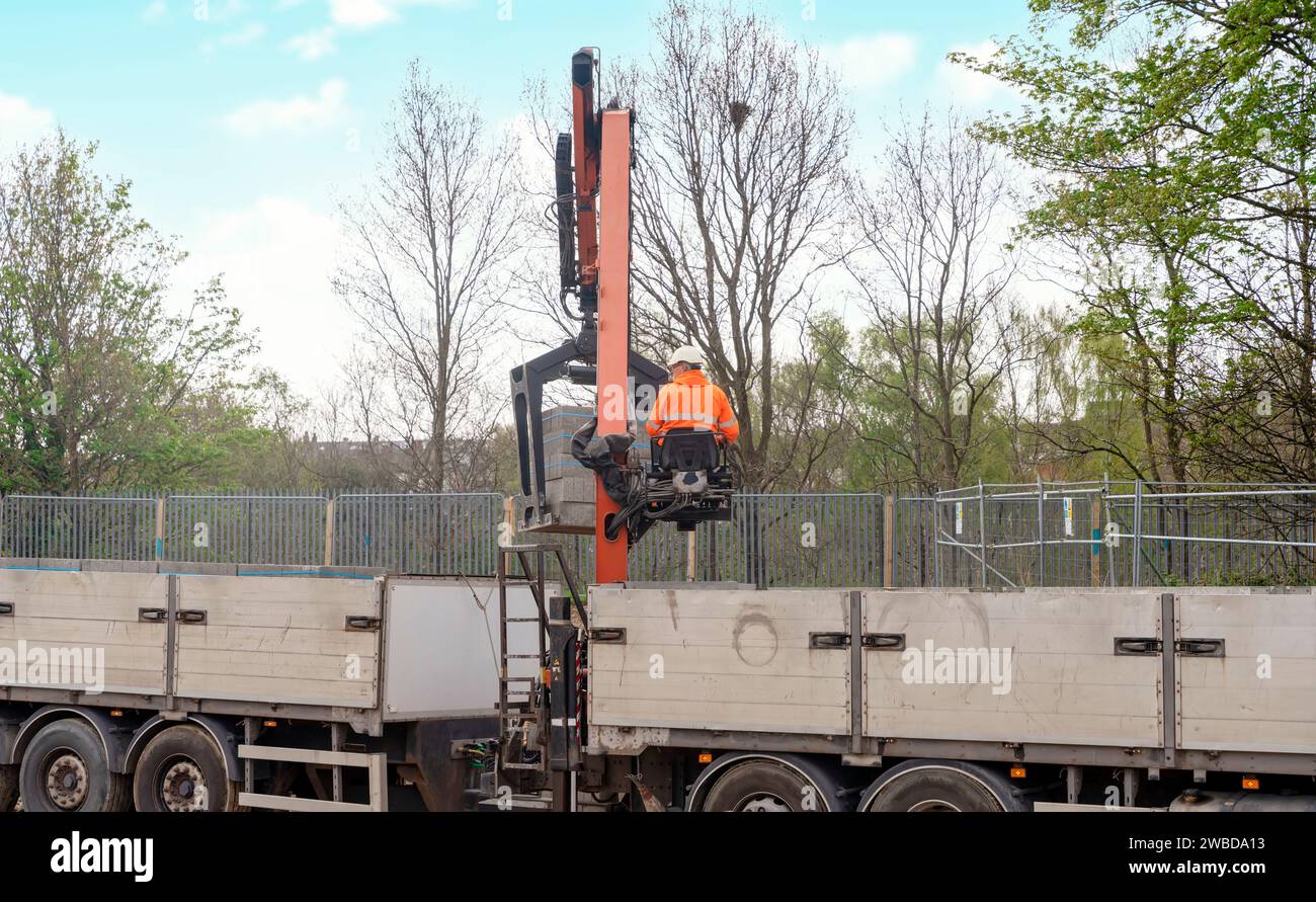 Close up of dropside flatbed HIAB crane lorry with brick grab ...