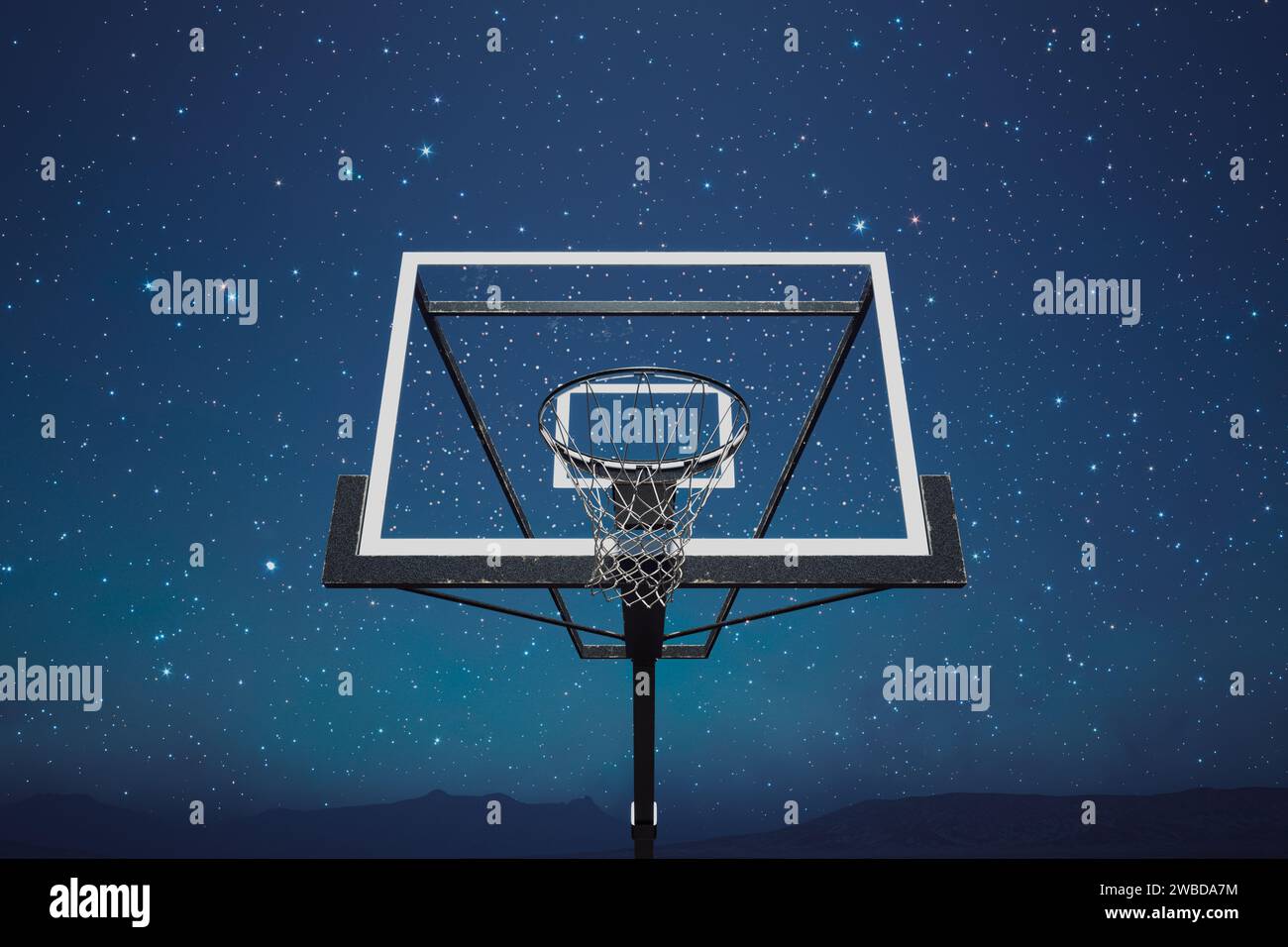 Captivating night scene featuring a basketball hoop in silhouette ...
