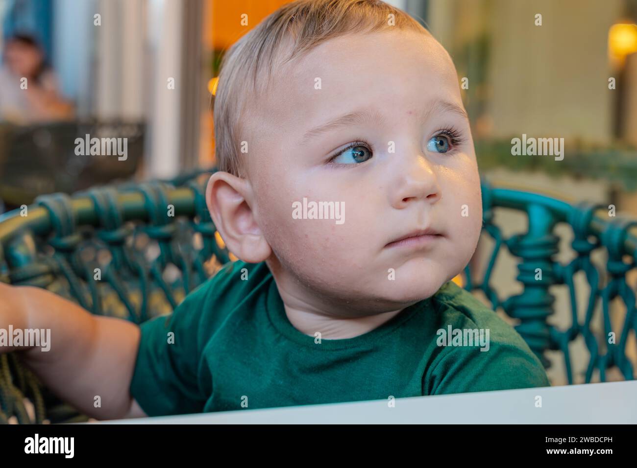 Boy sitting on a chair hi-res stock photography and images - Alamy