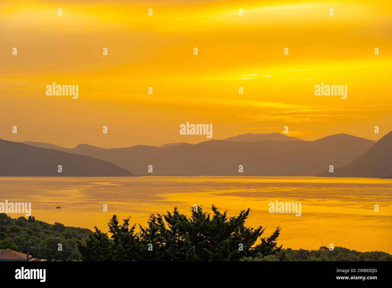 Dawn breaking behind the mountains of Mainland Greece from the Island ...