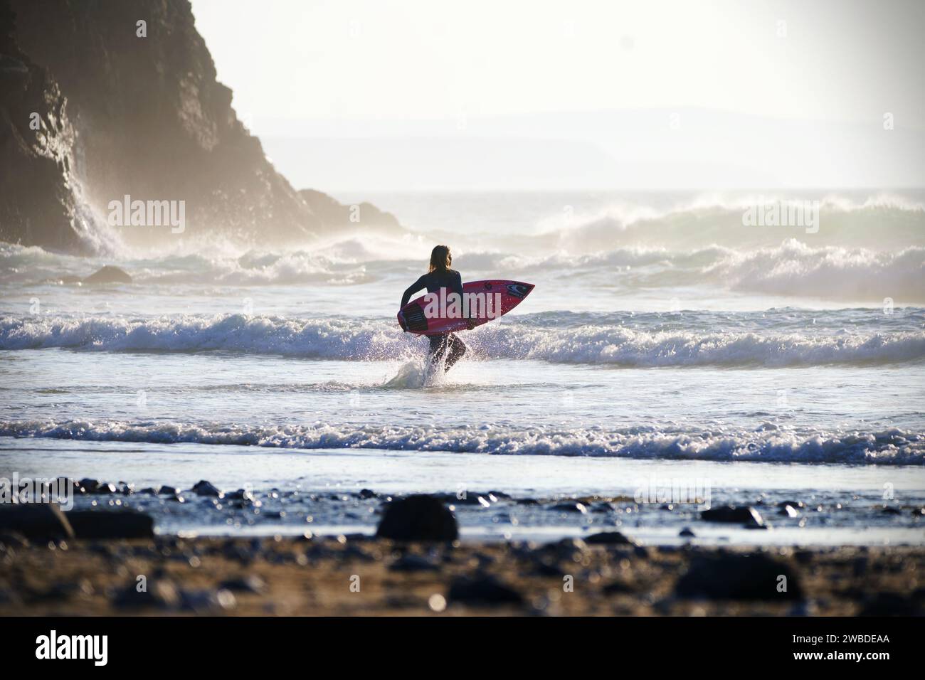 Surfer in at Porthtowan Beach, Cornwall Stock Photo - Alamy