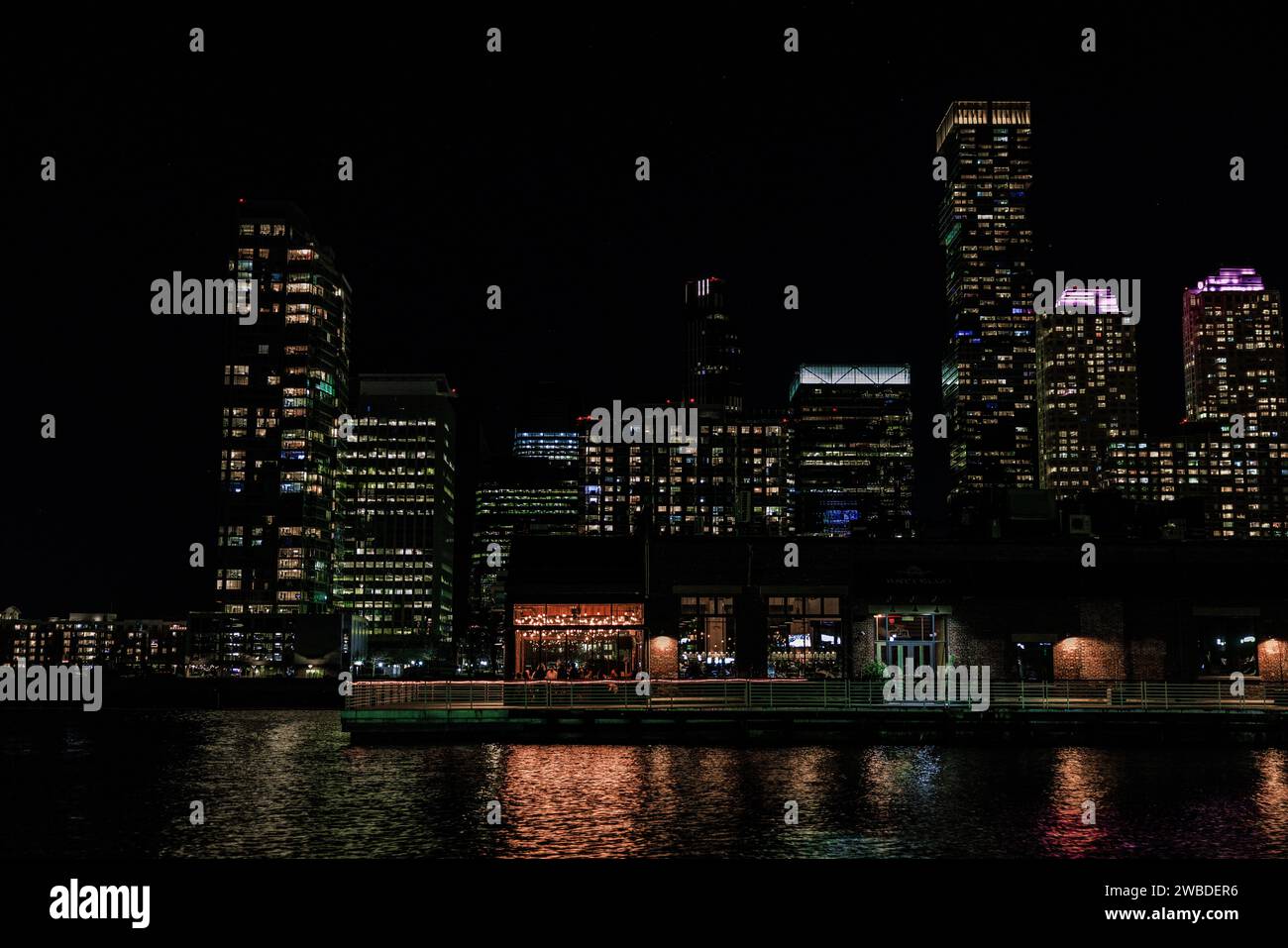 This image shows a beautiful night skyline of a city, illuminated with ...