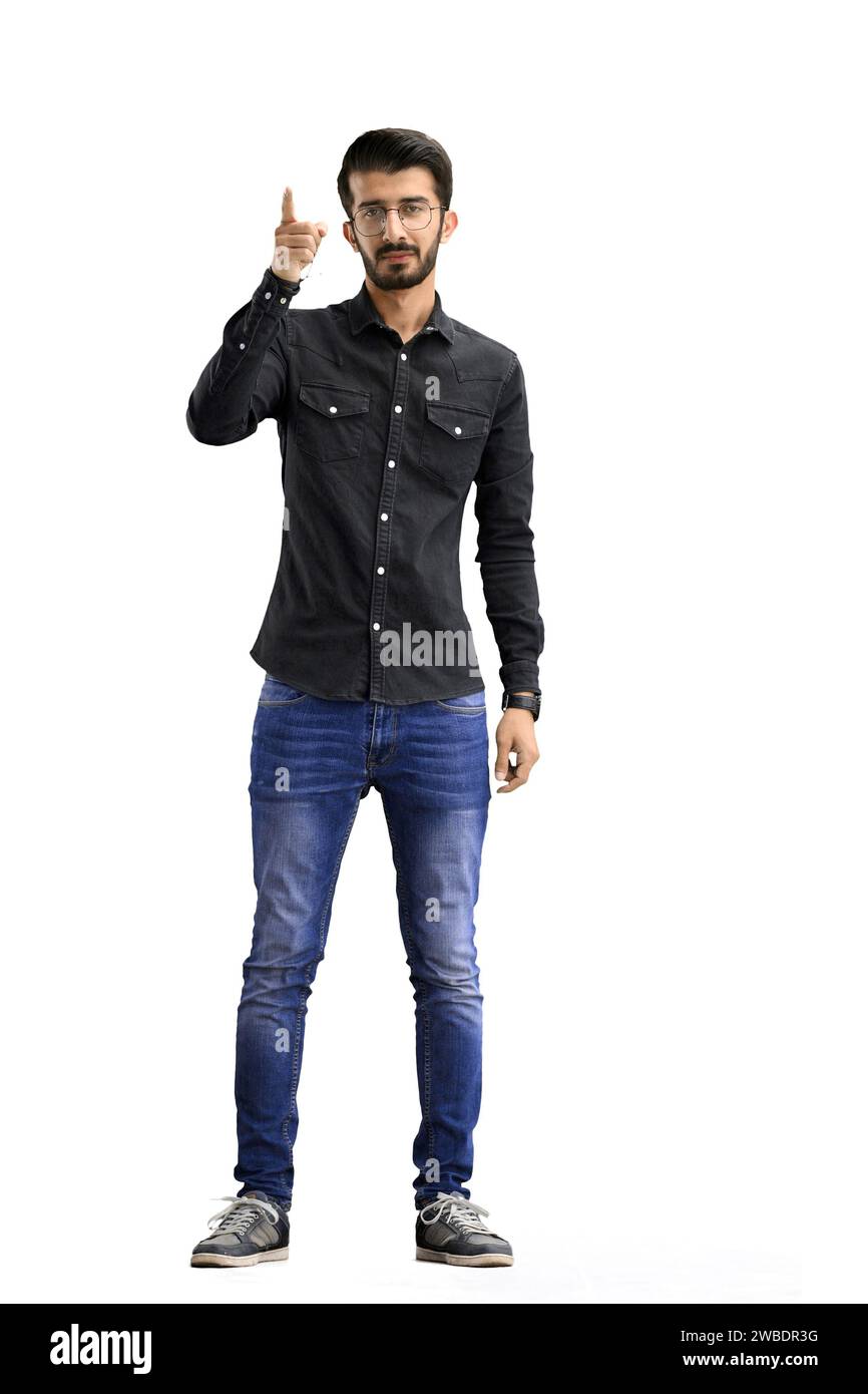 A man, on a white background, in full height, shows an important sign ...