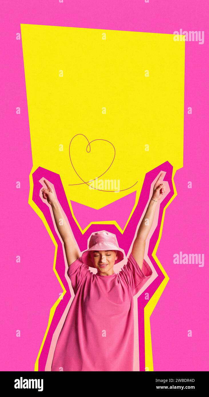 Beautiful young woman in stylish casual clothes raising hands over pink ...