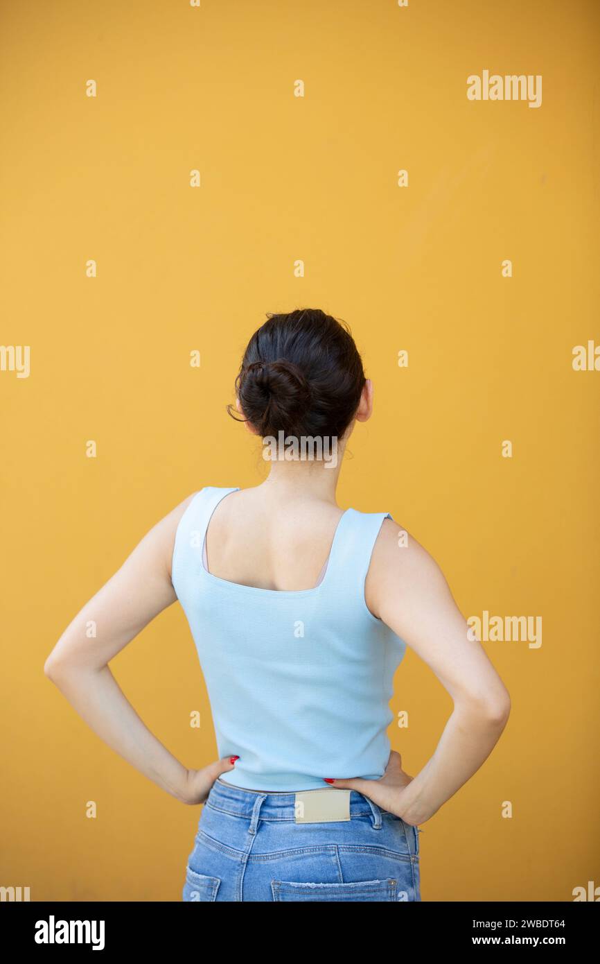 rear view woman hands on hips Stock Photo - Alamy