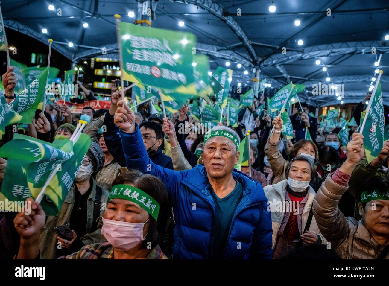 Keelung, Taiwan. 08th Jan, 2024. Supporters wave flags during the ...
