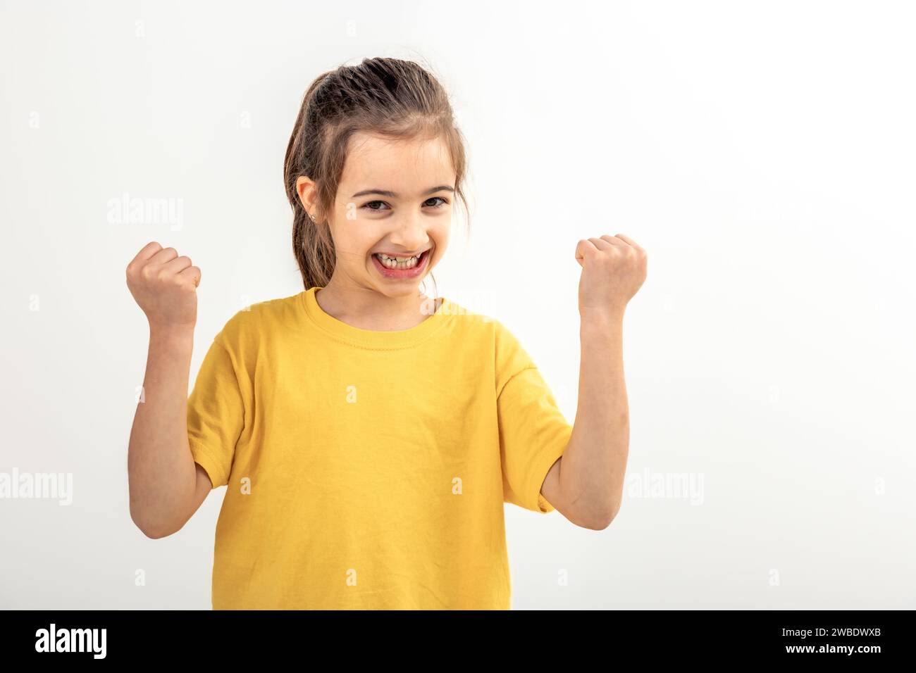 Funny girl hand flexing demonstrating biceps isolated on white ...
