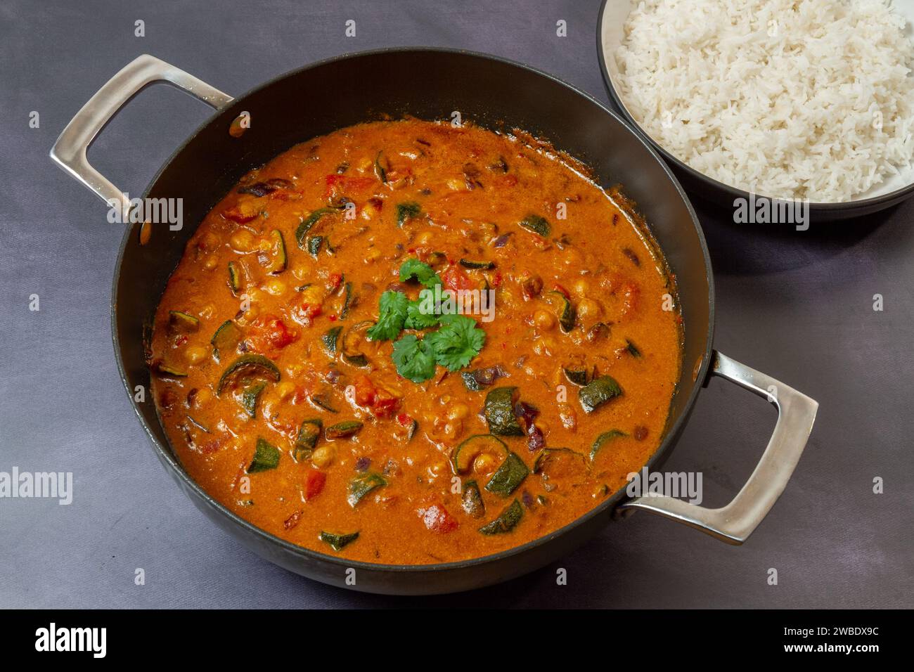 Courgette curry and basmati rice Stock Photo - Alamy