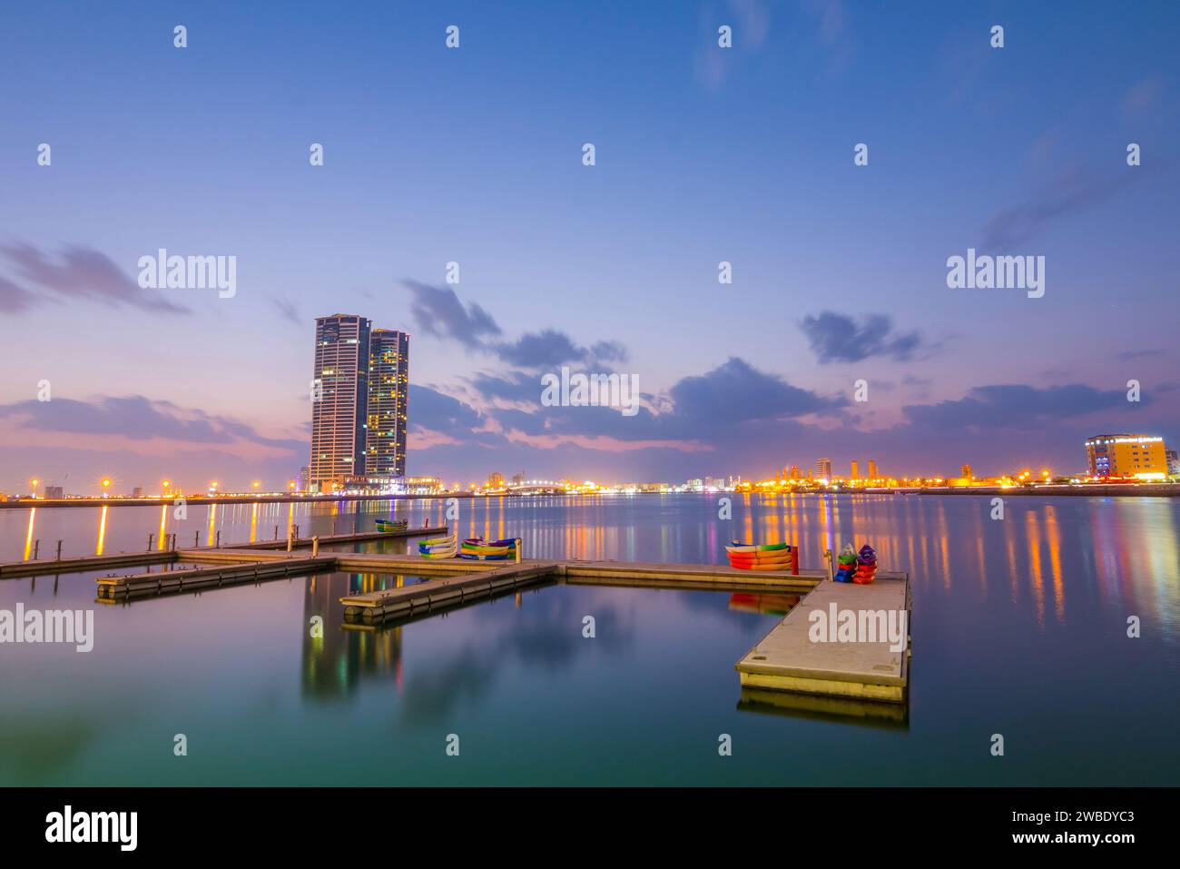 Ras Al Khaimah by night. View to beautiful bay with harbour in ...