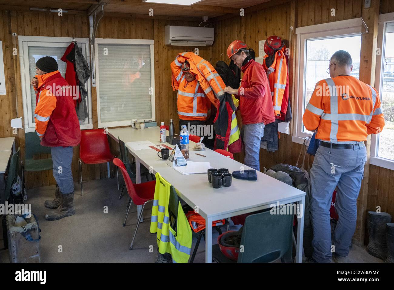 LEEUWARDEN - Construction workers take a break during their work at the ...