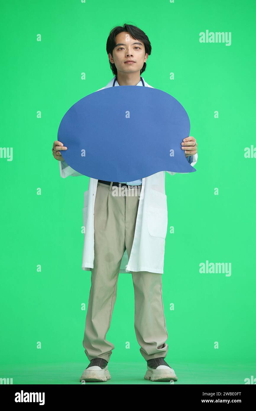 The guy is a doctor, on a green background, full-length, with a blue ...
