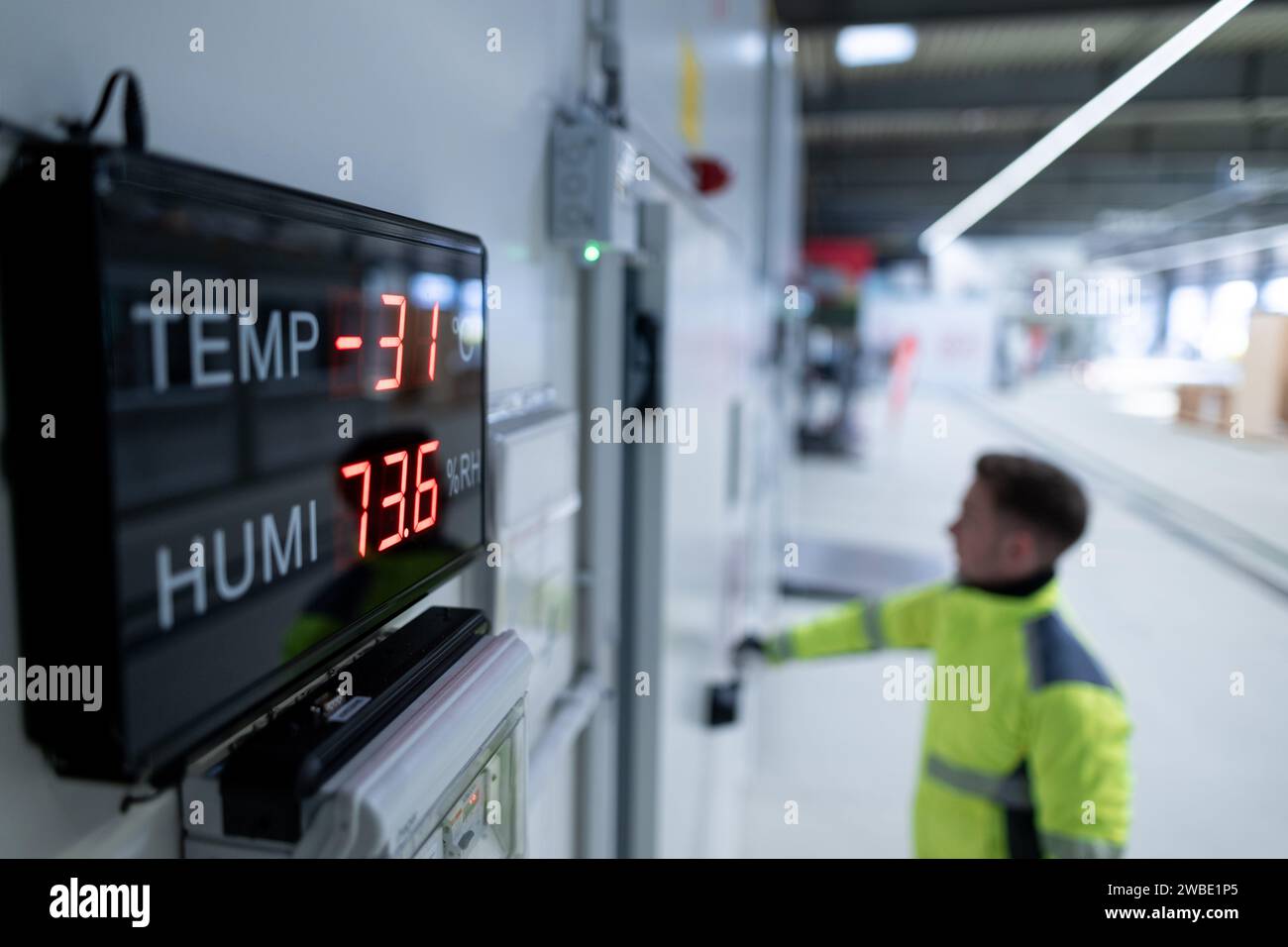 Essen, Germany. 10th Jan, 2024. An employee opens the door to a cool ...
