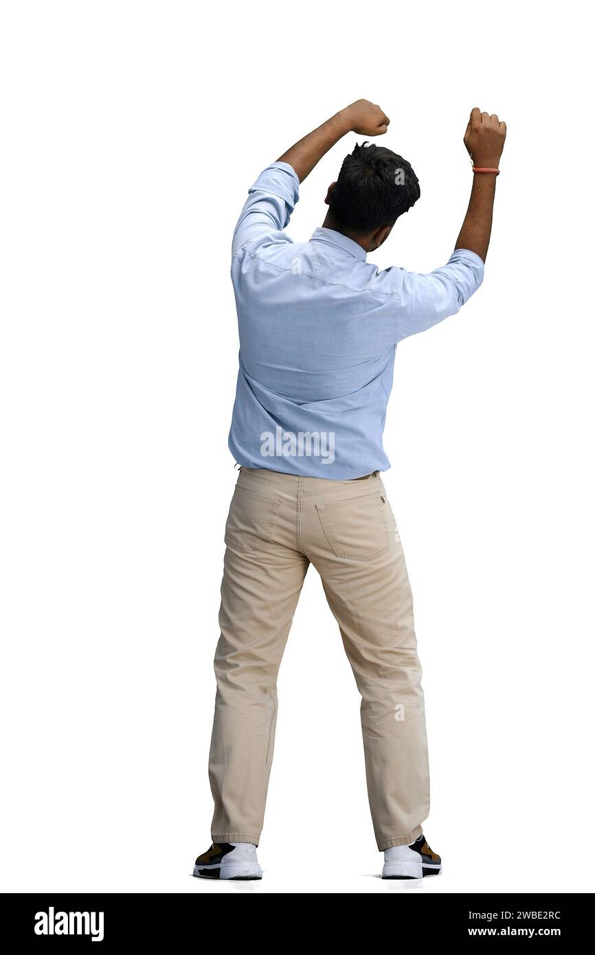 A man in a blue shirt, on a white background, standing tall, waving his ...