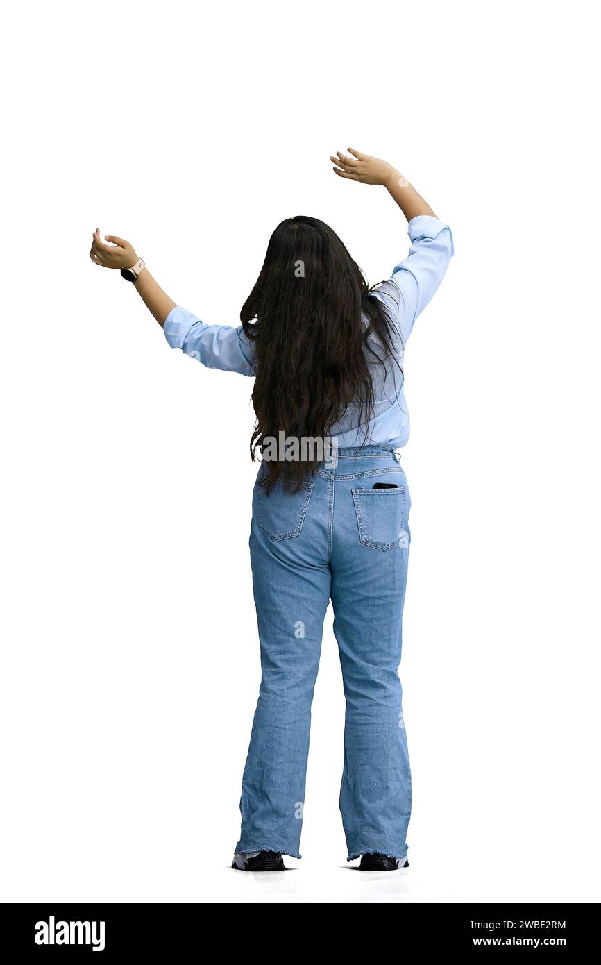 A girl in a blue shirt, on a white background, in full height, waving ...