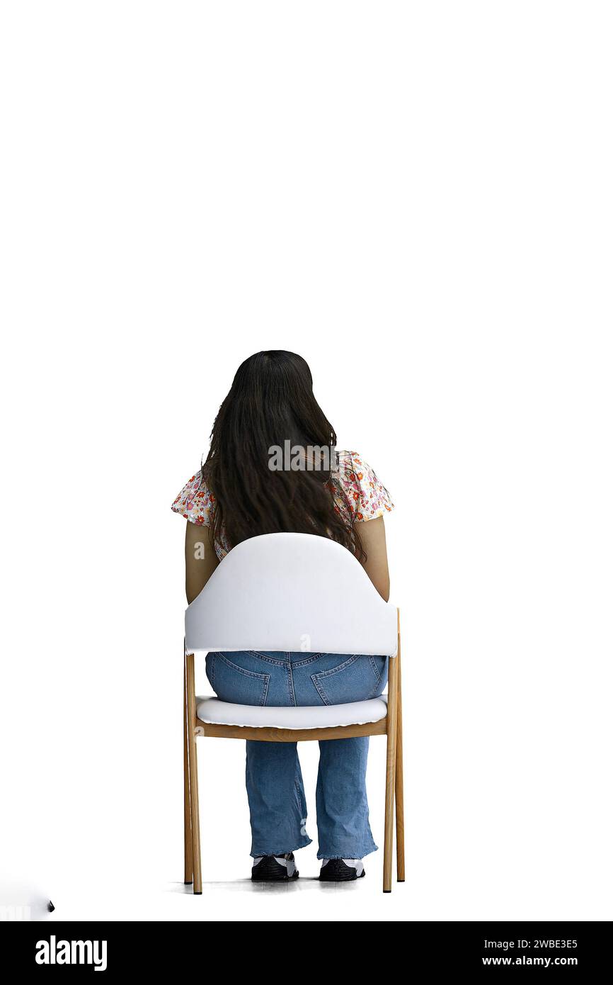 A woman, on a white background, full-length, sitting on a chair, back ...