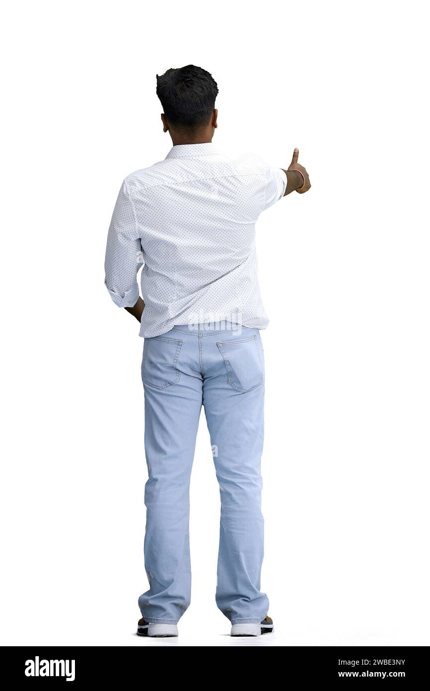 A man in a white shirt, on a white background, in full height, shows a ...