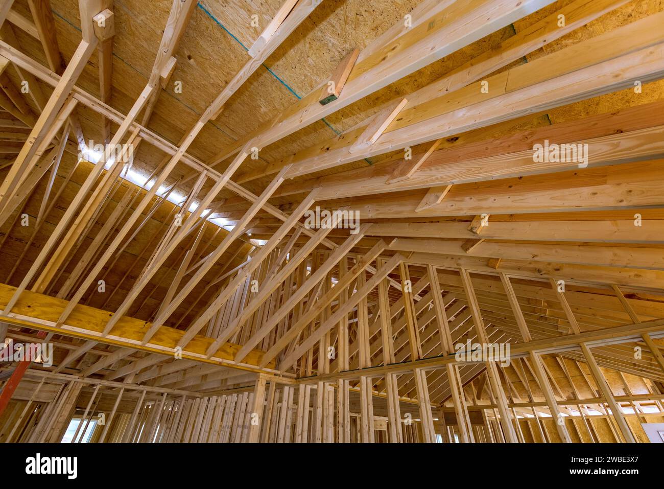 Construction of new home is unfinished, including beams stick trusses ...