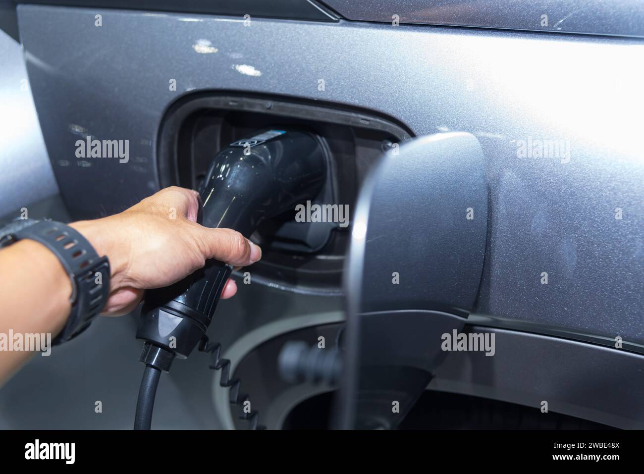 Connect the EV plug for charging the EV car Stock Photo - Alamy