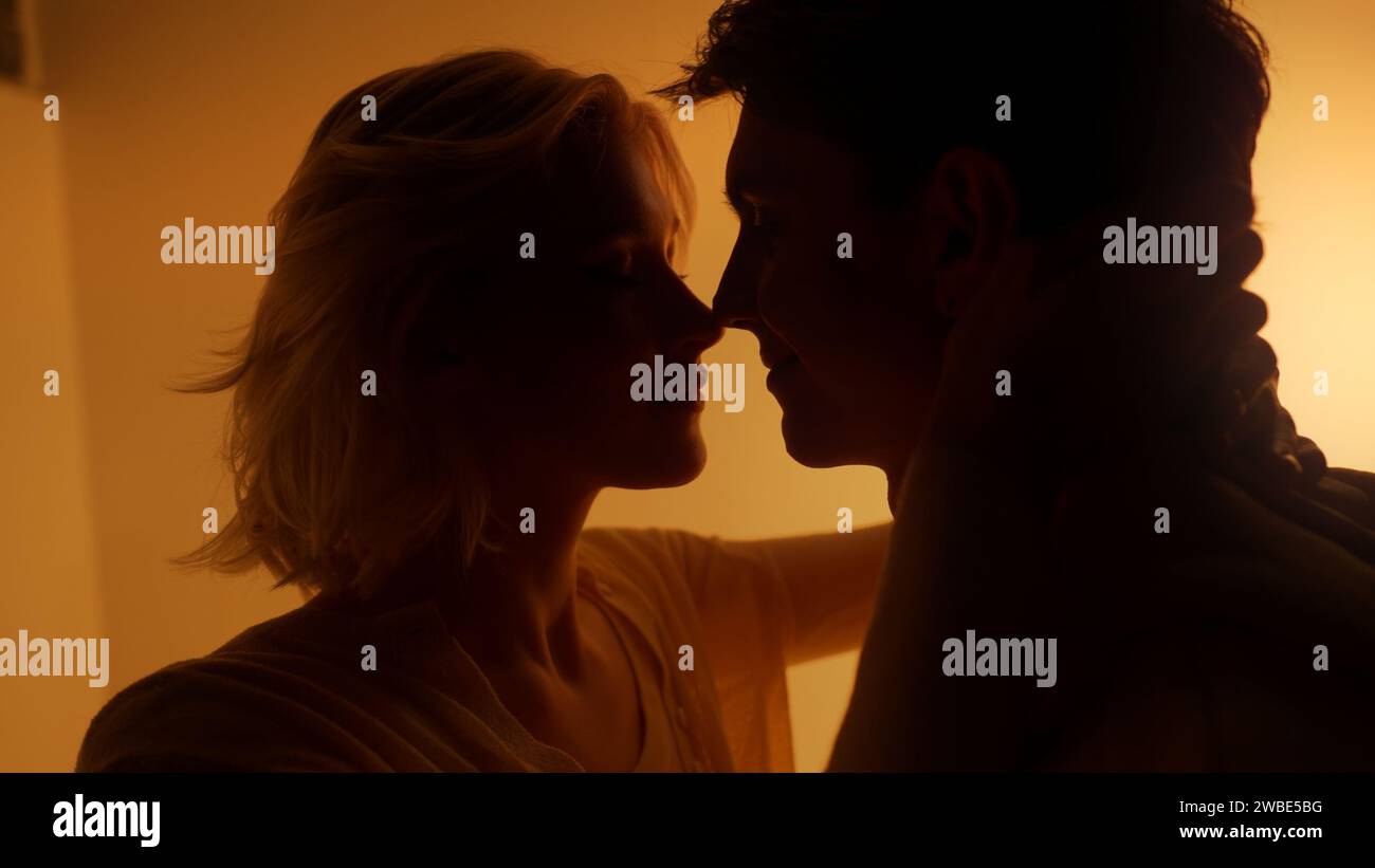 Lovely Couple Kissing And Touching Each Other During Romantic Date In
