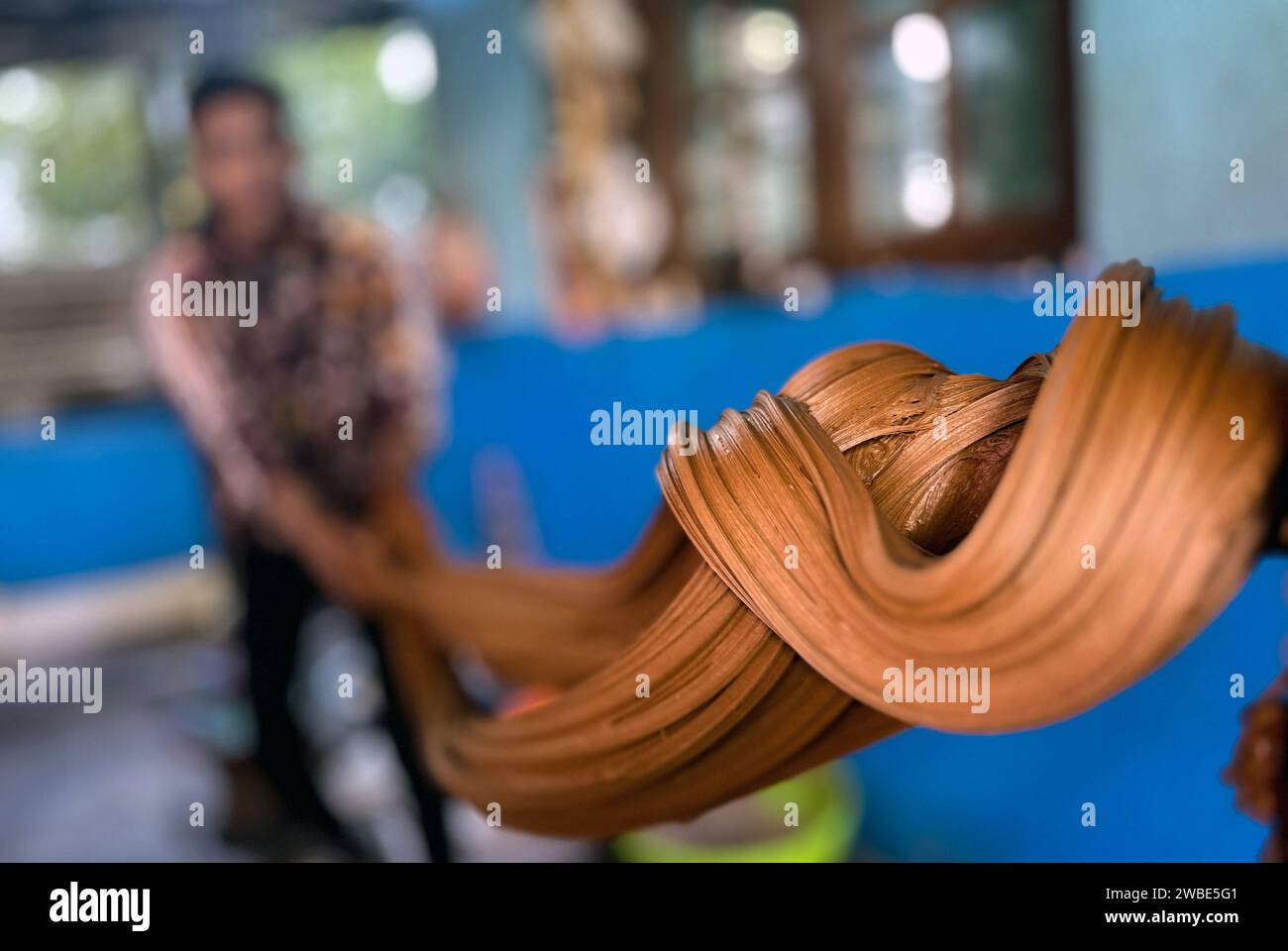 Kathmandu, Bagmati, Nepal. 10th Jan, 2024. A man whips the hard-boiled ...