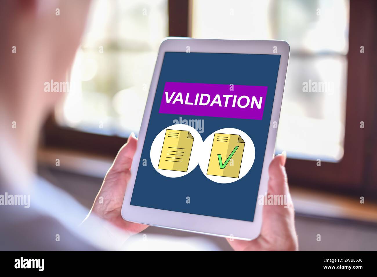 Tablet screen displaying a document validation concept Stock Photo - Alamy