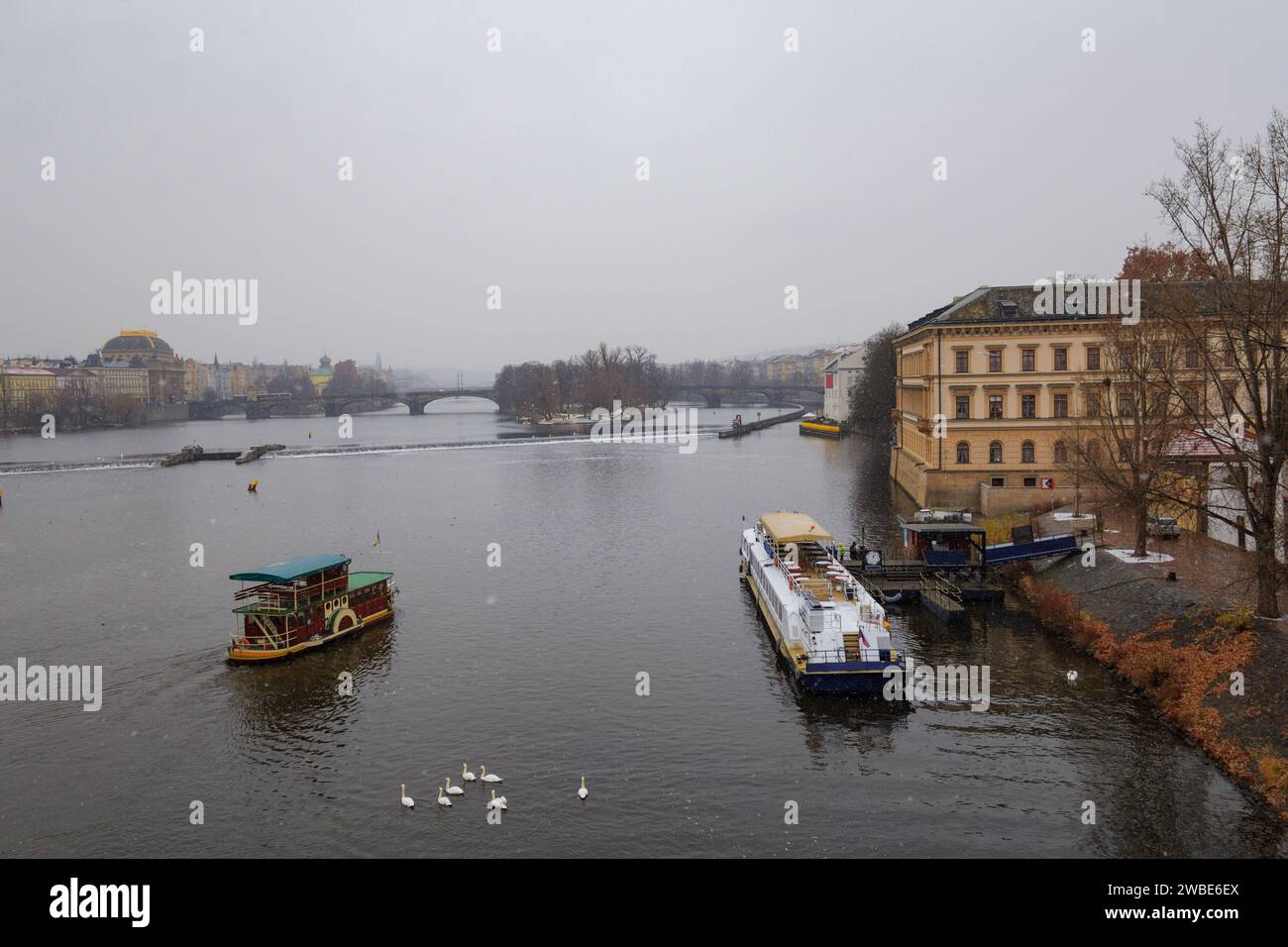 Two ships on the Vltava river in Prague Czech republic on a winter day ...