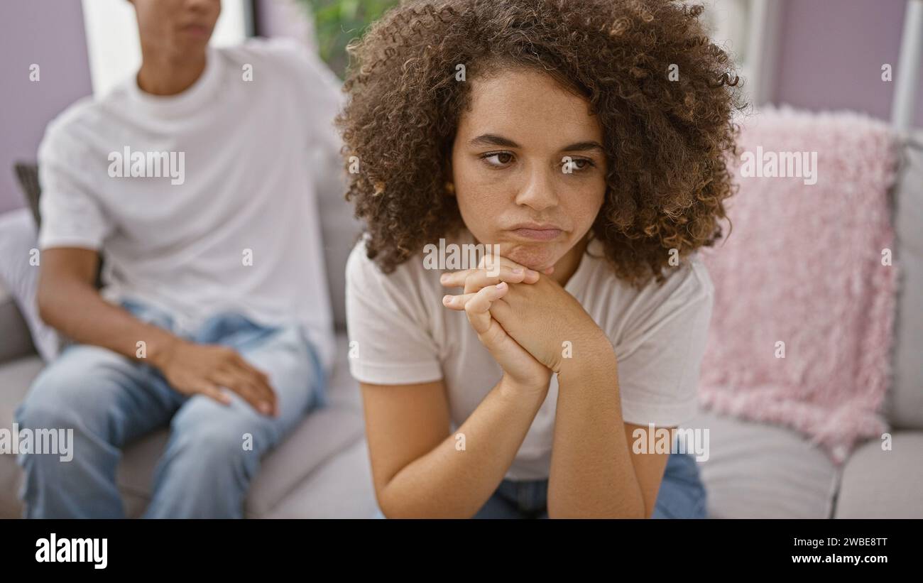Stressed beautiful couple arguing on their sofa at home, love on the ...
