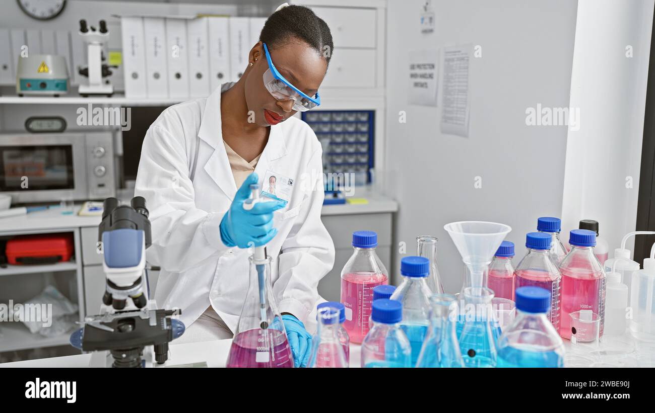 Black beauty in lab goggles, focused african american woman scientist ...