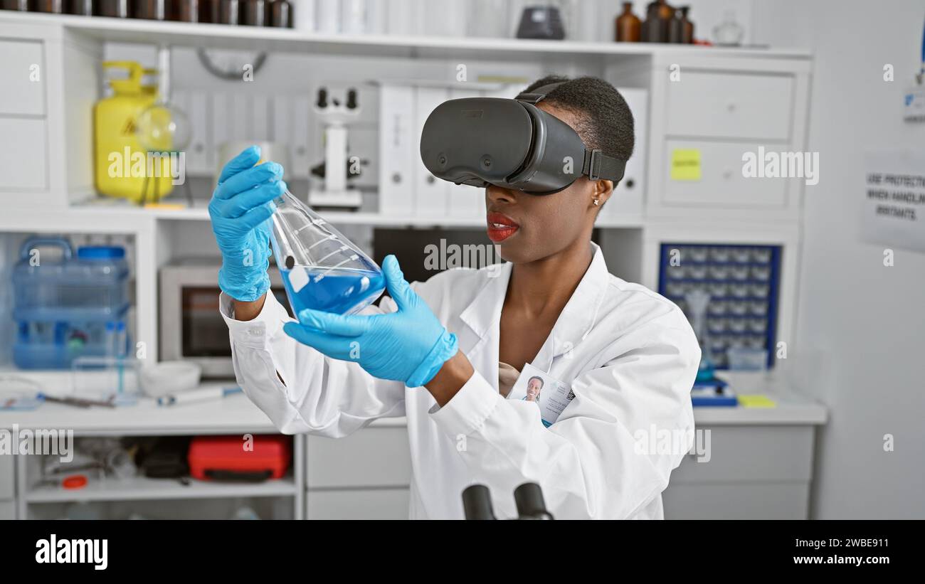 Beautiful african american woman scientist engrossed in high-tech vr science experiment at lab ...