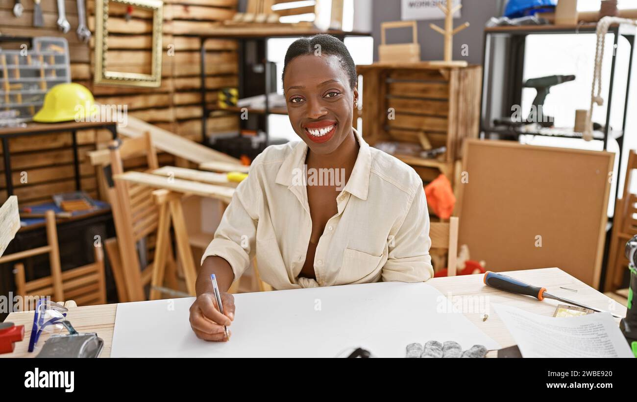 Beautiful African American Woman Carpenter Smiling And Drawing In