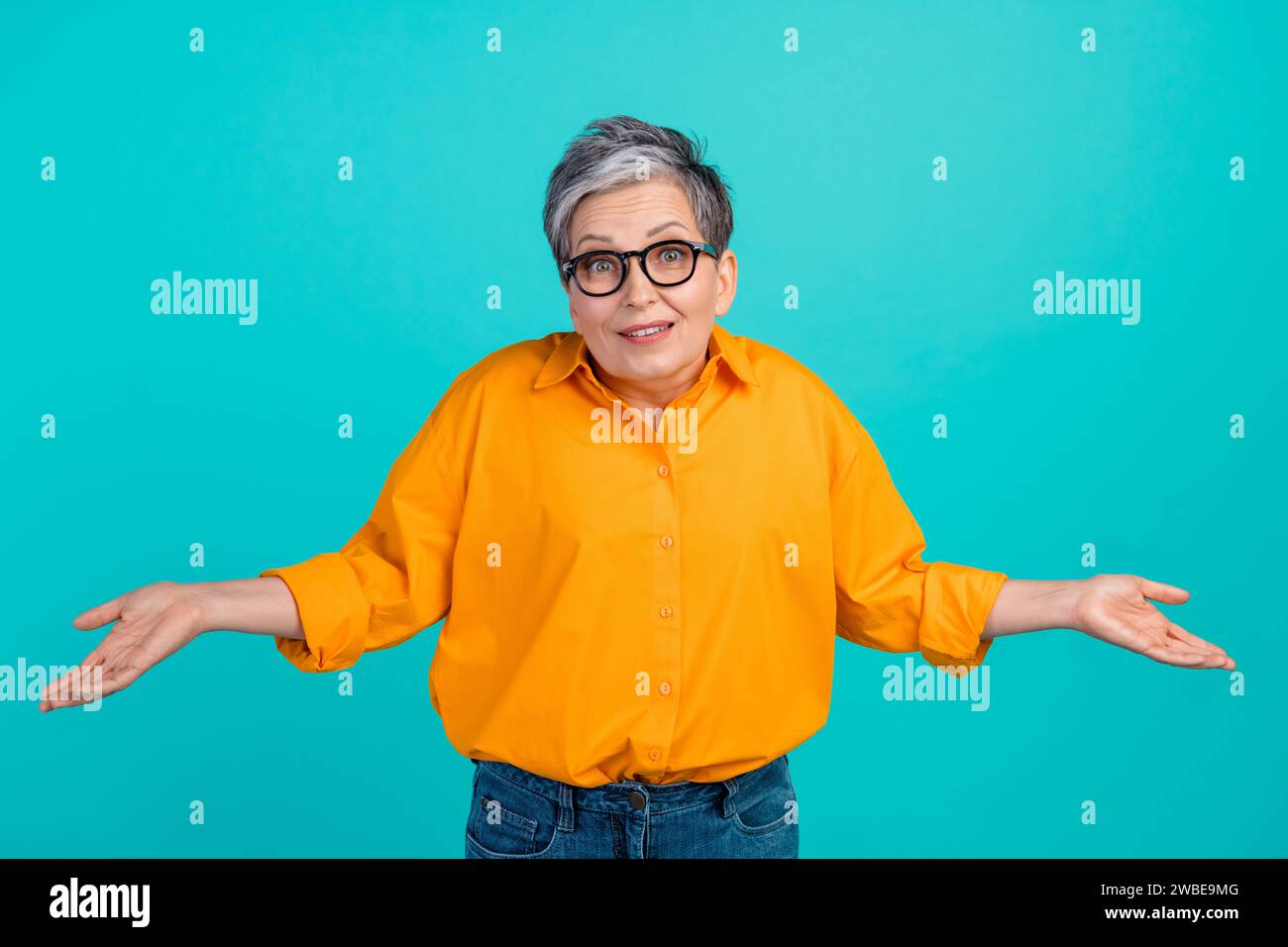 Photo of confused business woman mature aged specialist shrug shoulders ...