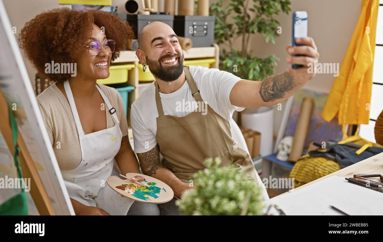 Two smiling artists strike a confident pose, taking a captivating ...