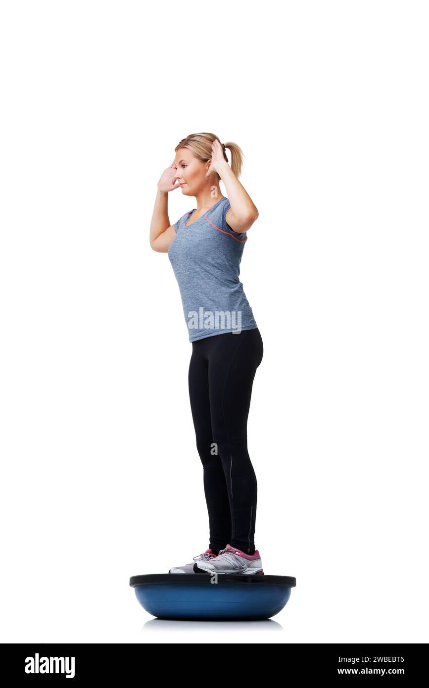 Woman, balance ball and standing for fitness, exercise or workout on ...
