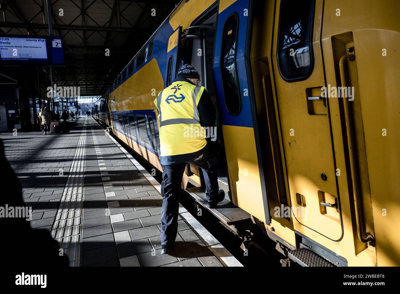 EINDHOVEN - Staff cleans a train. According to the NS, staff shortages ...