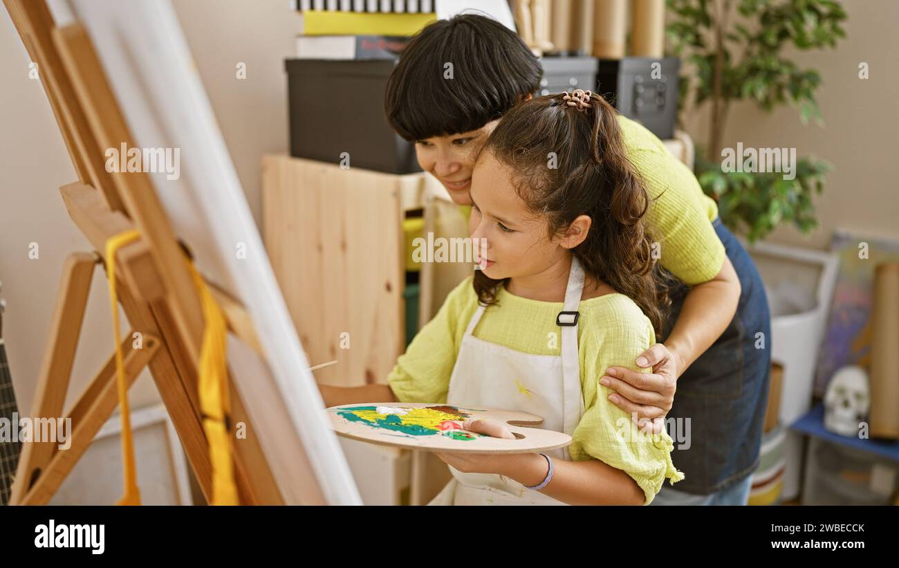 Mother and daughter drawing together, artist teacher inspiring ...