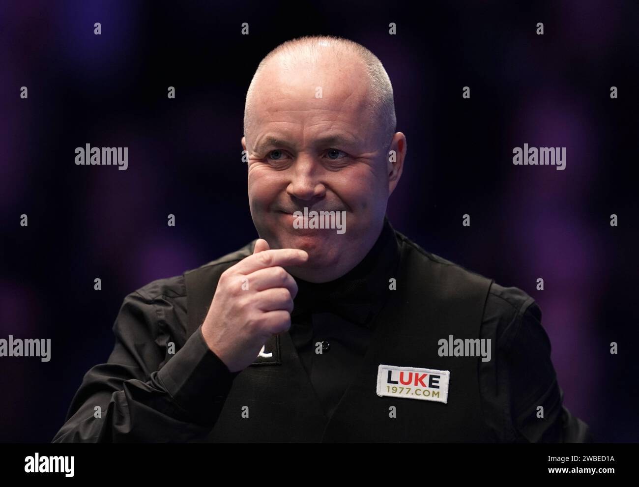 John Higgins reacts during his match against Mark Allen during day four ...