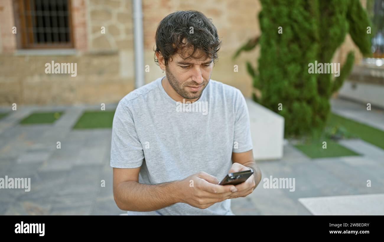 Handsome, young hispanic guy with blond beard gets lost in his ...