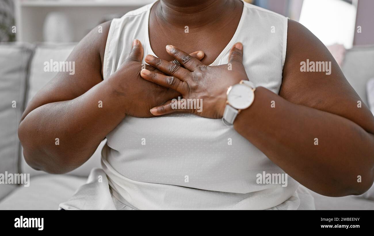 Heartfelt gratitude, overweight african american woman, hands on chest ...