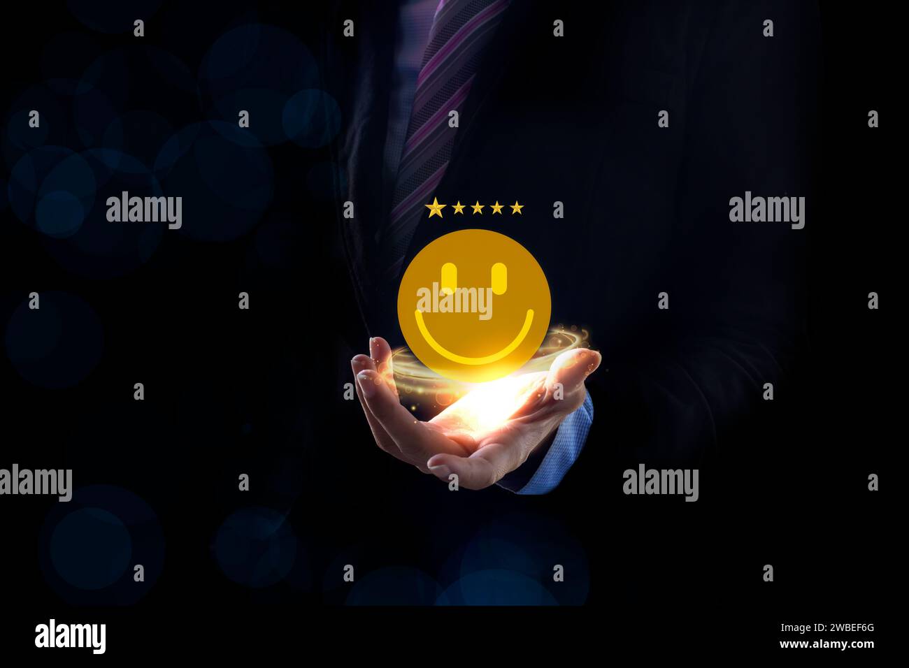 Businessman holding smile icon for the best evaluation, good feedback ...