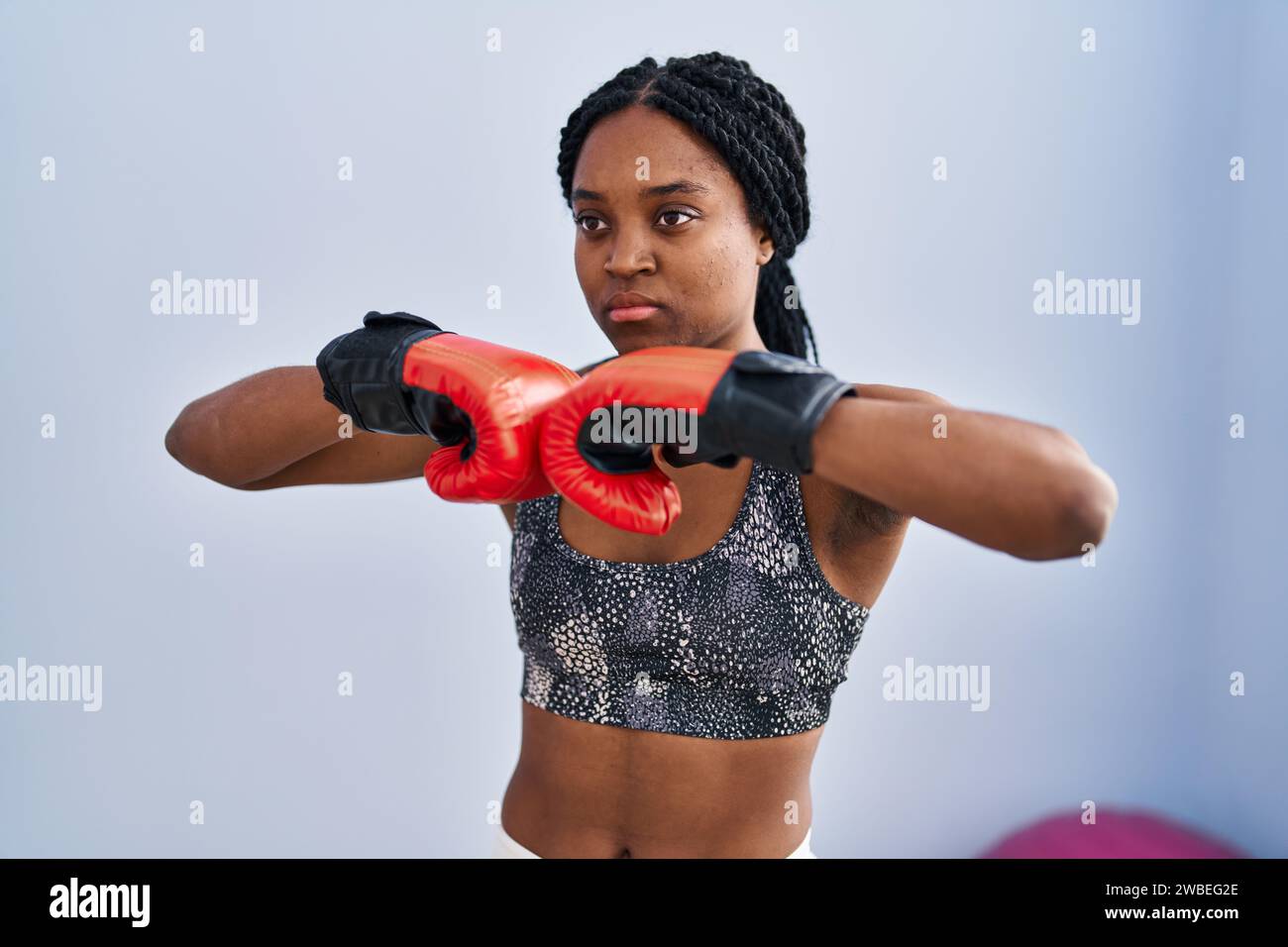 African american woman boxing with concentrate expression at sport ...