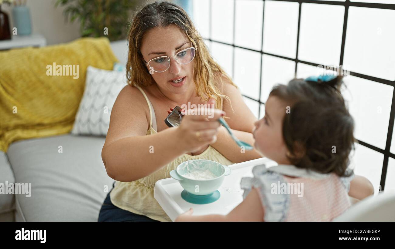 During baby's lunch time, mom and daughter create unforgettable home ...