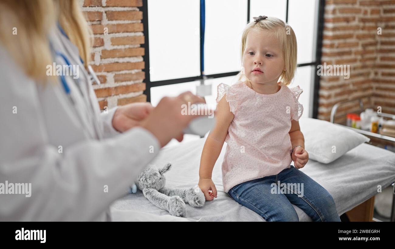 Caring doctor and brave little patient bonding during a critical ...