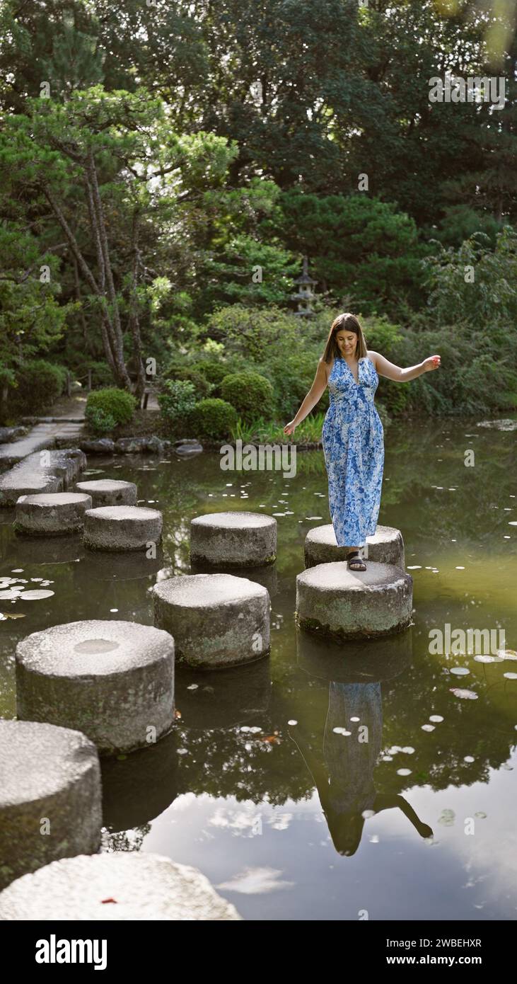 Beautiful hispanic woman's leisurely summer walk along stone path ...