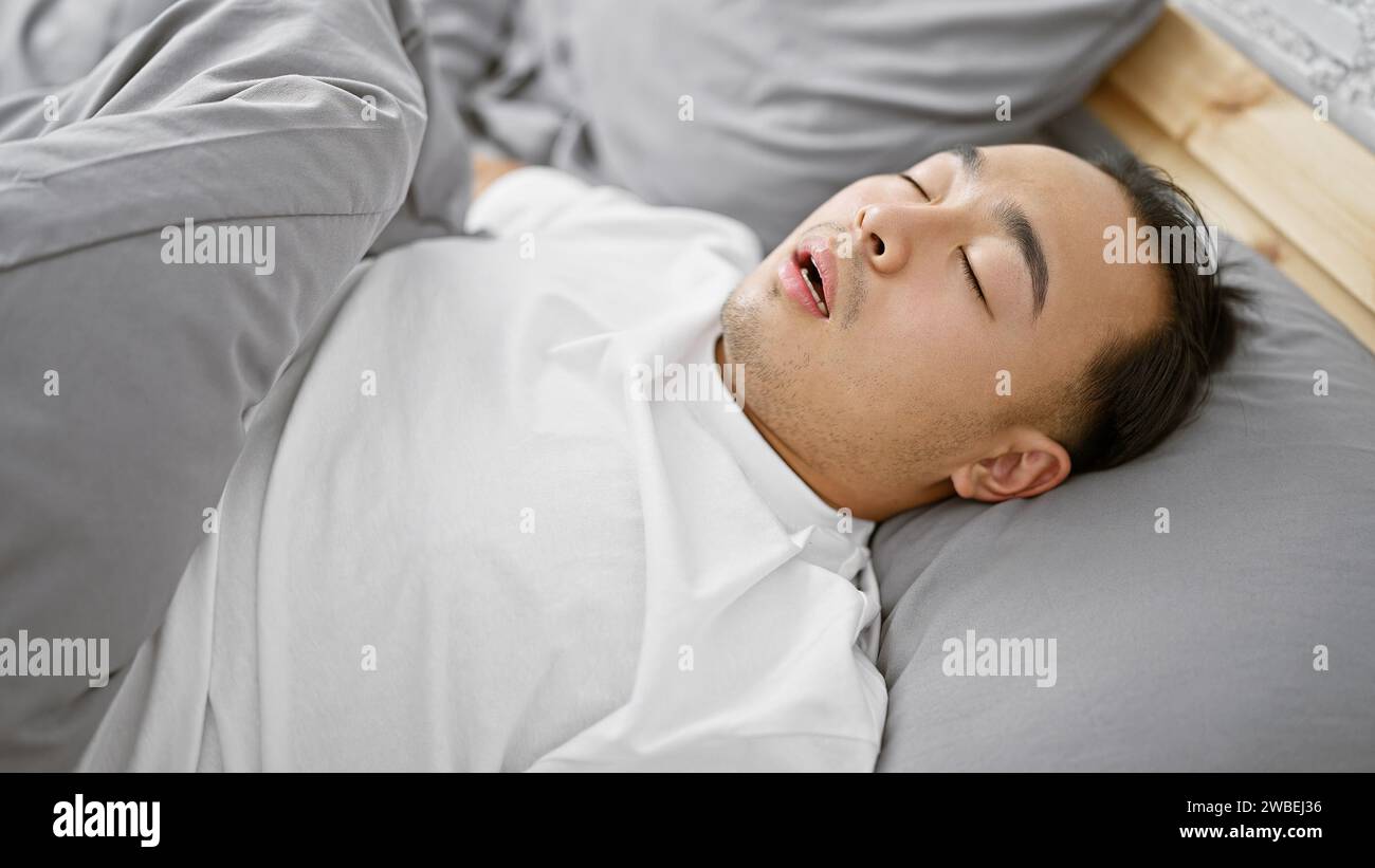 Young chinese man sleeping comfortably hi-res stock photography and images - Alamy