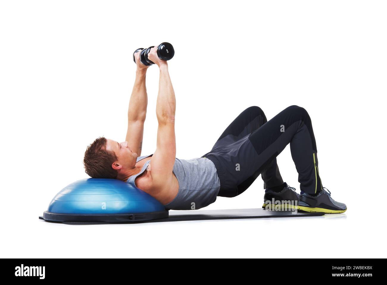 Dumbbells, half ball and man exercise for muscle building, workout or ...